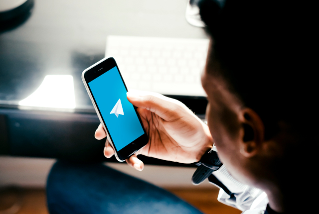 smartphone telegram man hand – BusinessTech